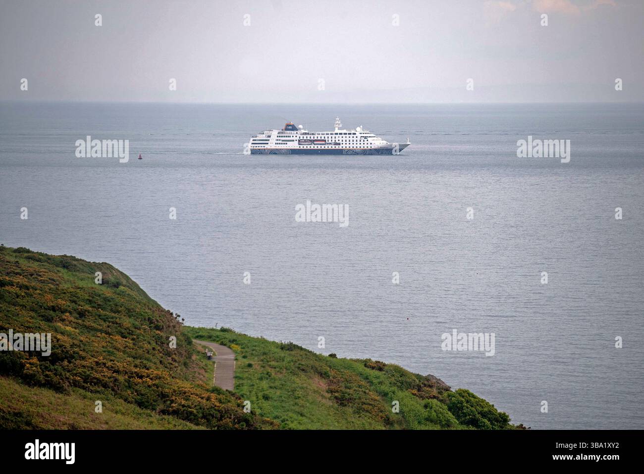 Swansea, UK. 11th May, 2025. The cruise liner MV Hamburg makes its way ...
