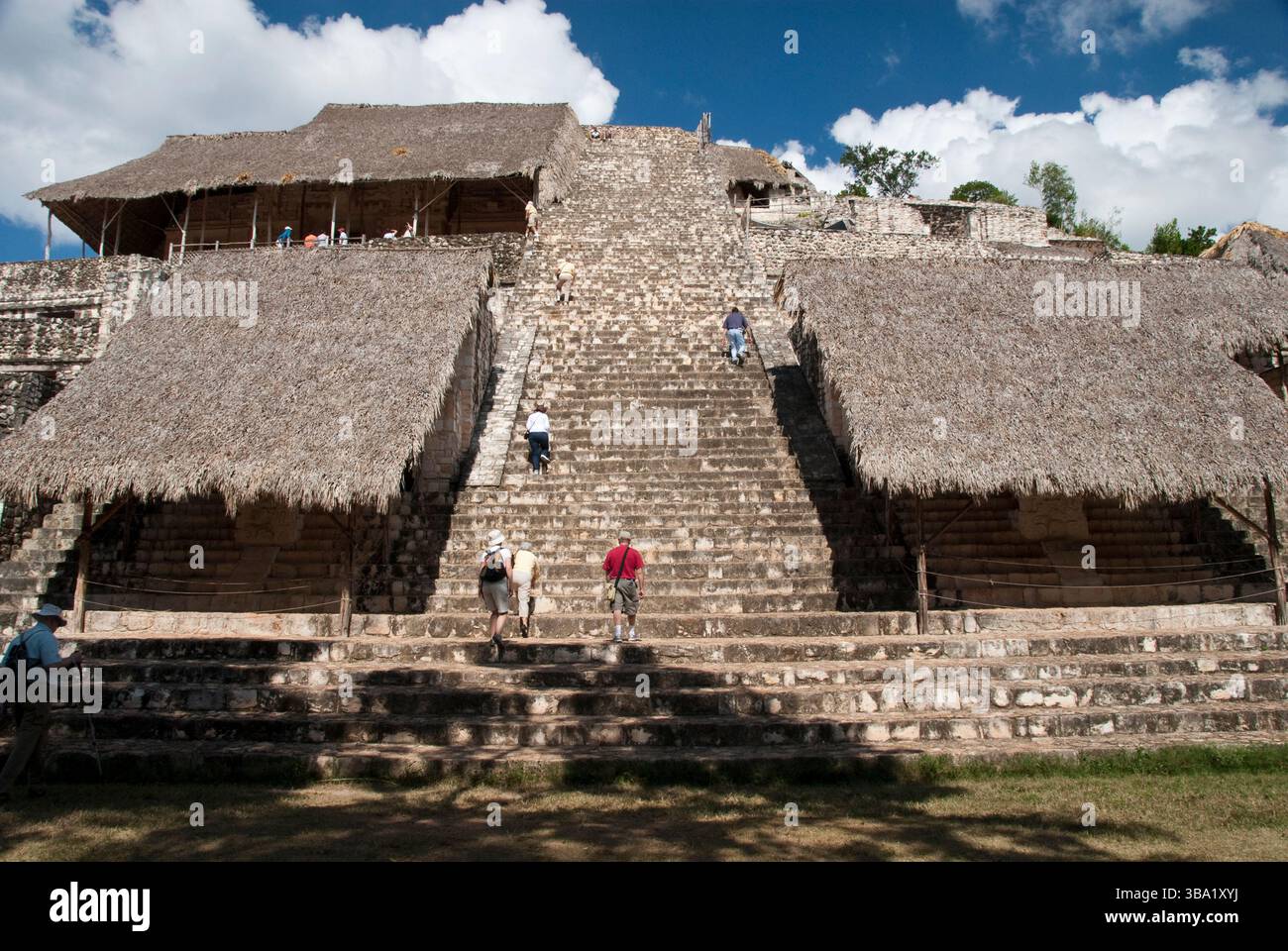 Tourists climb steep steps at the Acropolis, at the Mayan ...