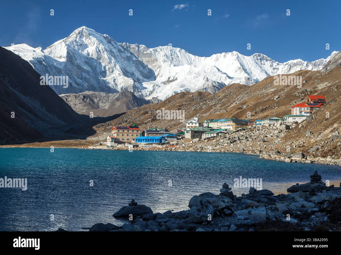 View of Gokyo lake and village with mount Cho Oyu and cloud blue sky ...