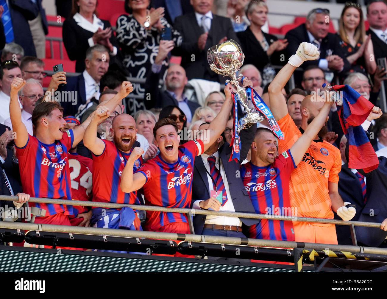 Aldershot Town's Aaron Jones lifts the trophy after the Isuzu FA Trophy ...