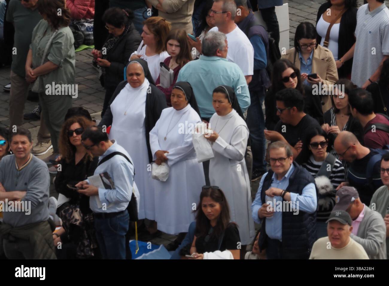 Caserta, Italy. 11th May, 2025. Faithful await the arrival of the new ...