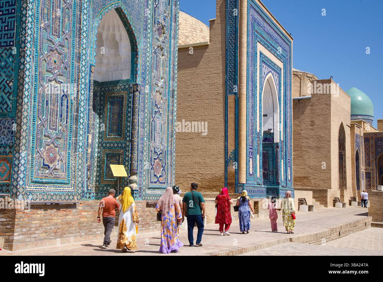 Group of uzbek women in traditional dress and men walking hi-res stock ...