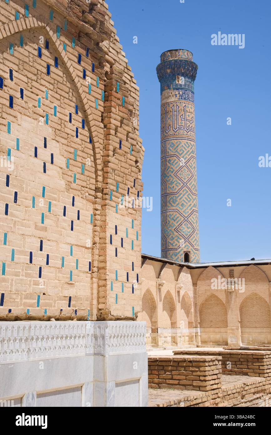Minaret and wall with coloured tiles at Bibi-Khanym Mosque, Samarkand ...