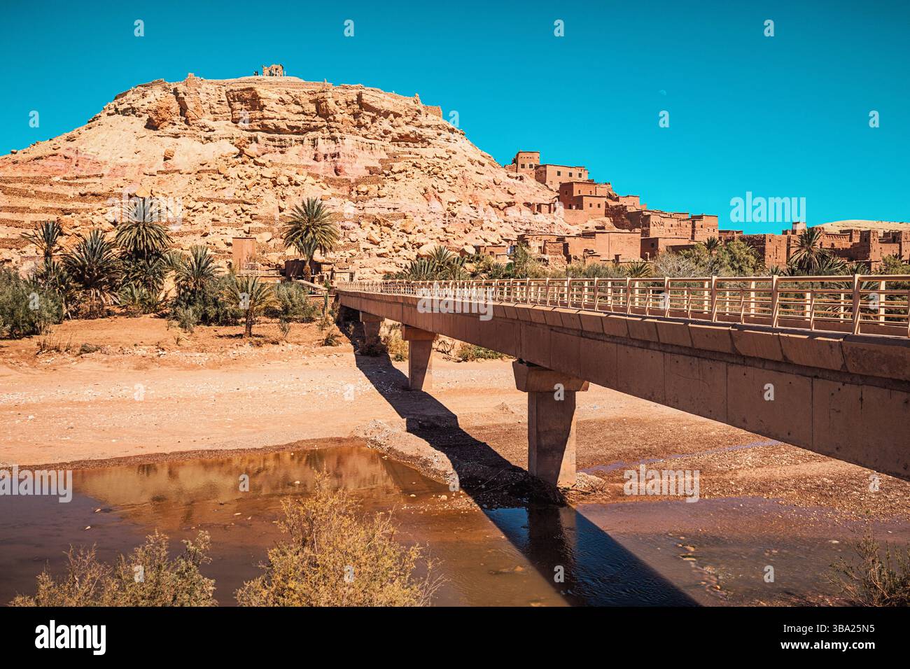 Concrete bridge crossing a river leading to the ancient fortified city ...
