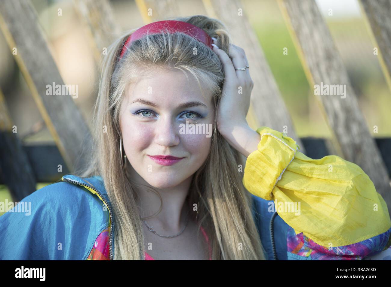 Beautiful country girl in 90s style with bright makeup and sports ...