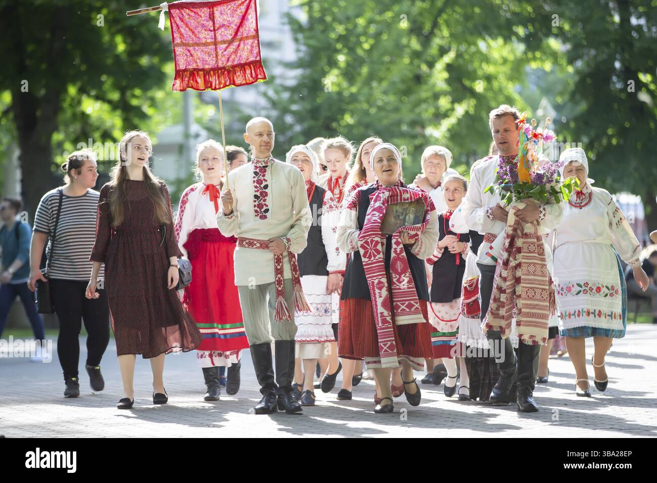 People in Belarusian national costumes perform a national ethnic ritual ...