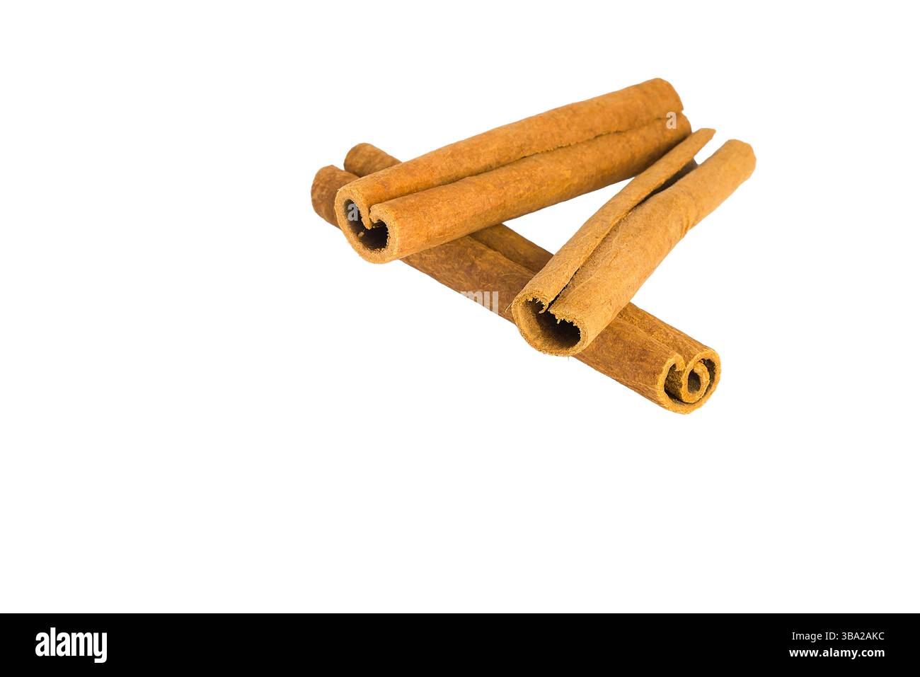 Variety of cinnamon bark segments on a white backdrop, highlighting ...