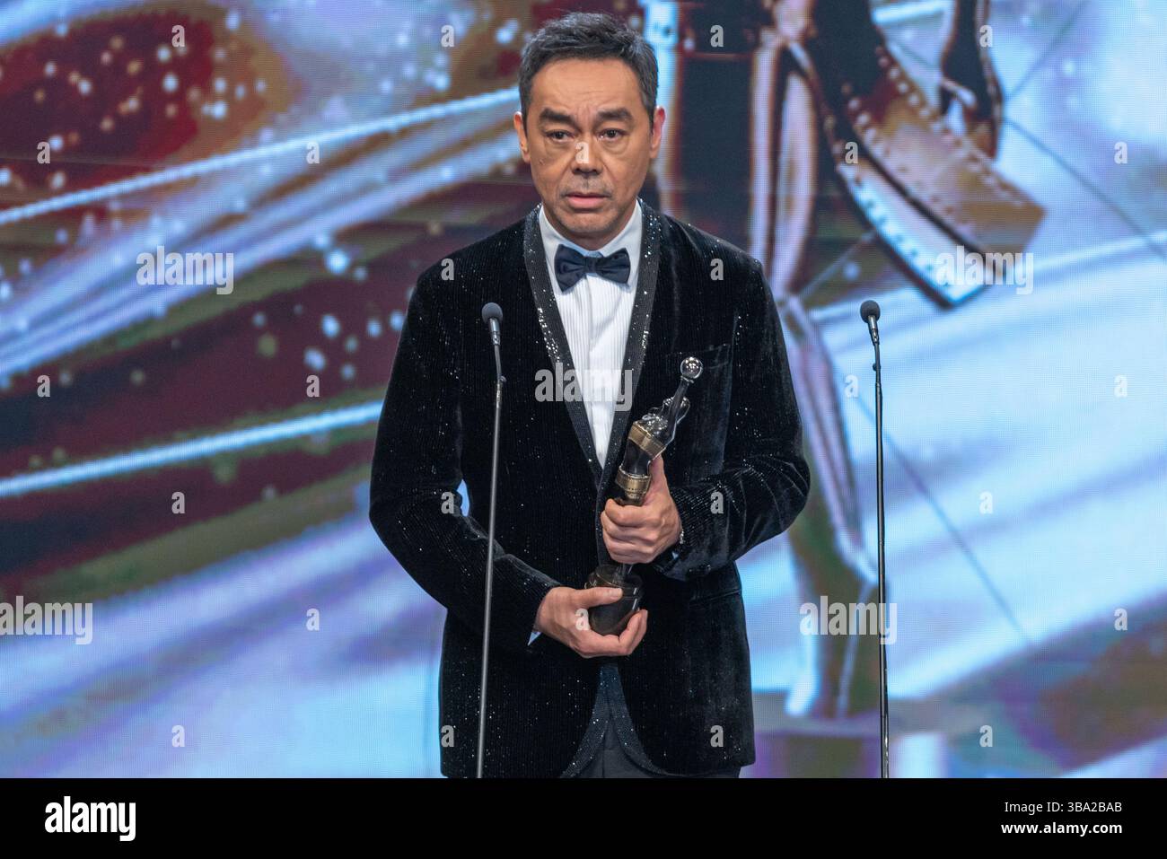 Sean Lau reacts after receiving the Best Actor award for the film Papa ...