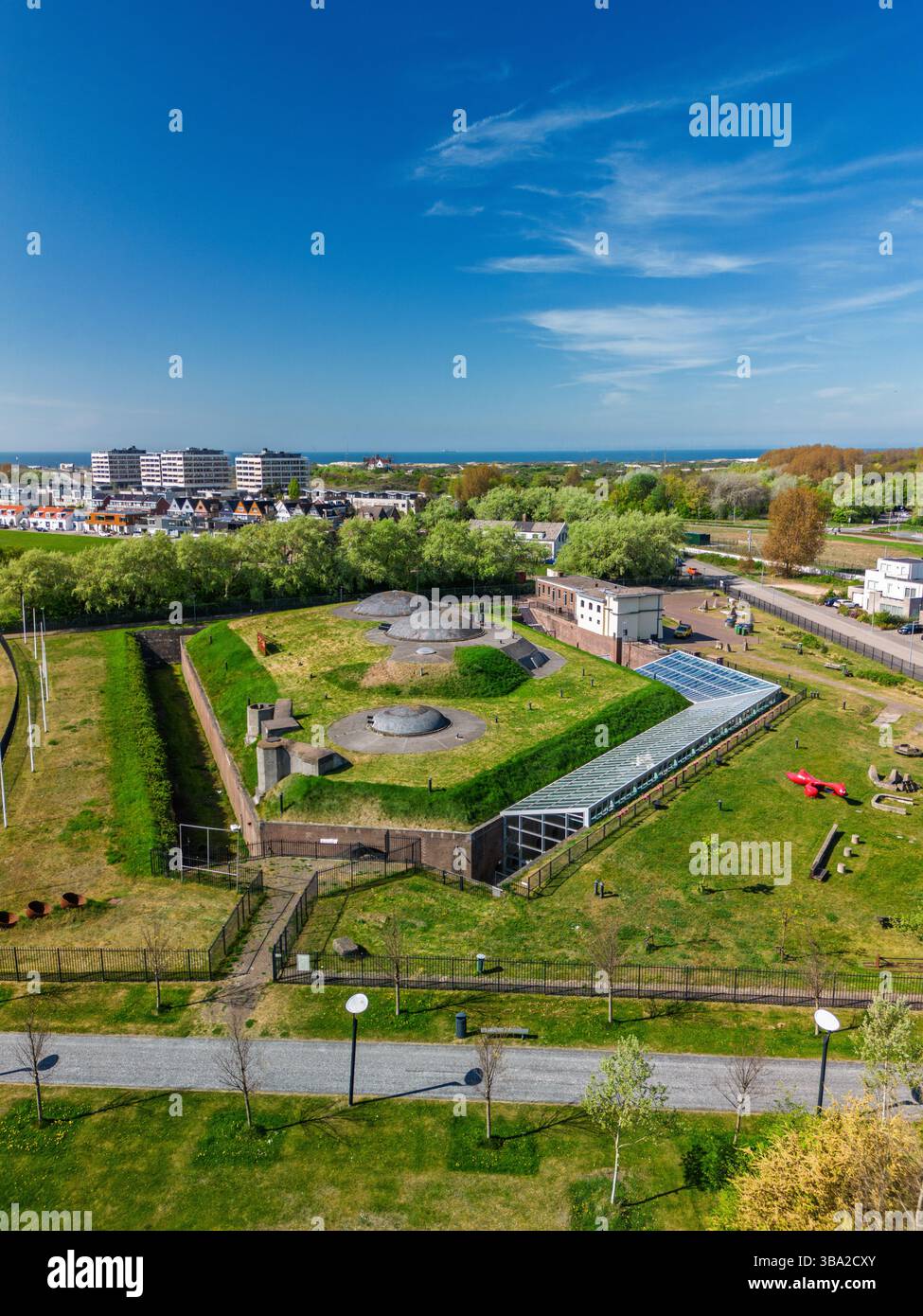 Aerial view of a historic military fort with grass-covered bunkers ...
