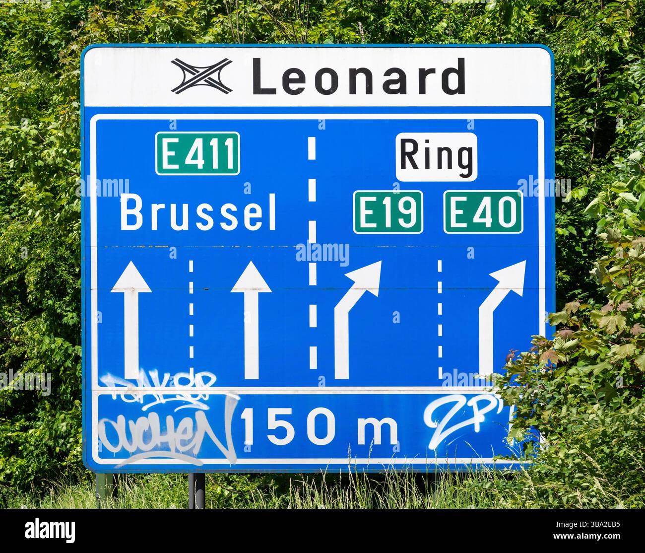 Blue Belgian road signs at the Leonard junction in Auderghem, Brussels ...