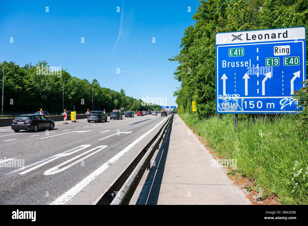 Blue Belgian road signs at the Leonard junction in Auderghem, Brussels ...