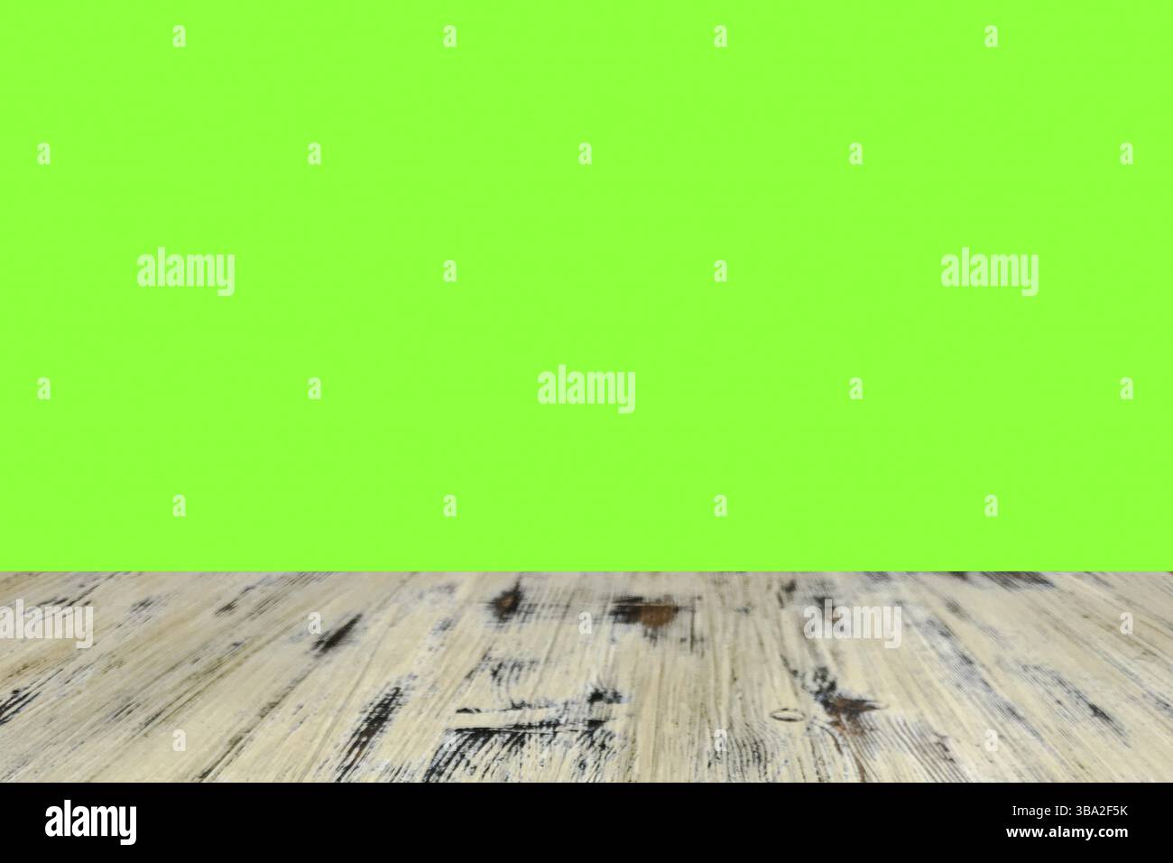 Old painted washed oak wood table on the blurry chroma key green screen ...