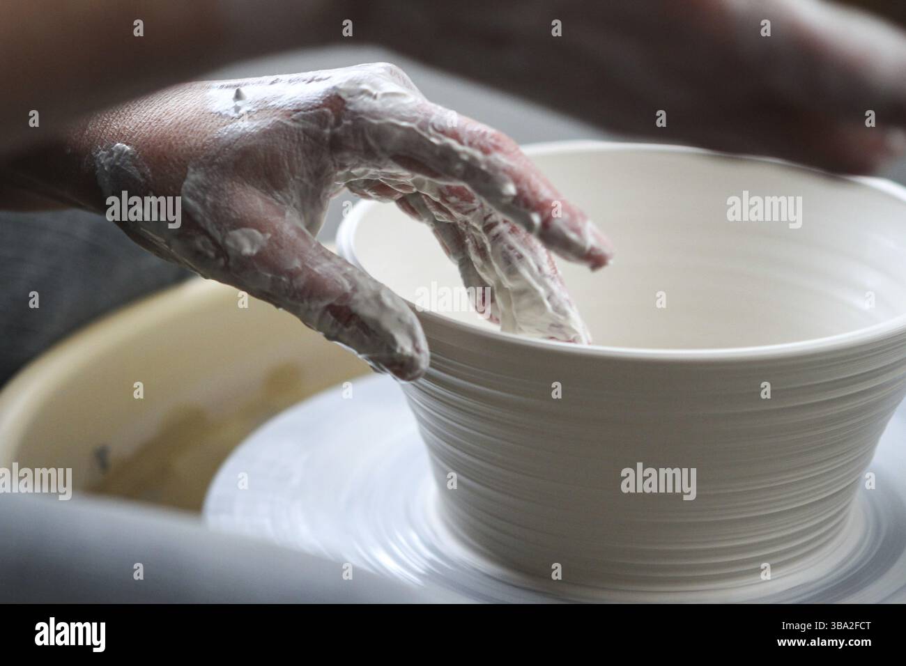 Potter works. Crockery creation process in pottery on potters' wheel ...