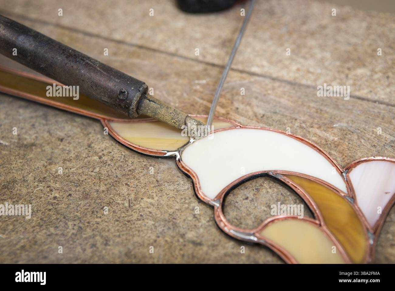 Stained glass maker works with colorful souvenirs Stock Photo - Alamy