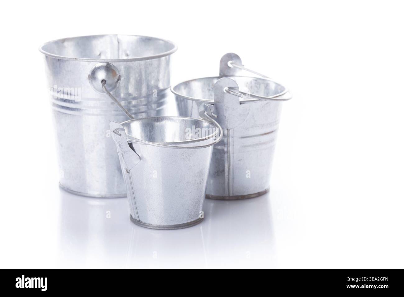 Three different in size empty buckets on a white background Stock Photo ...