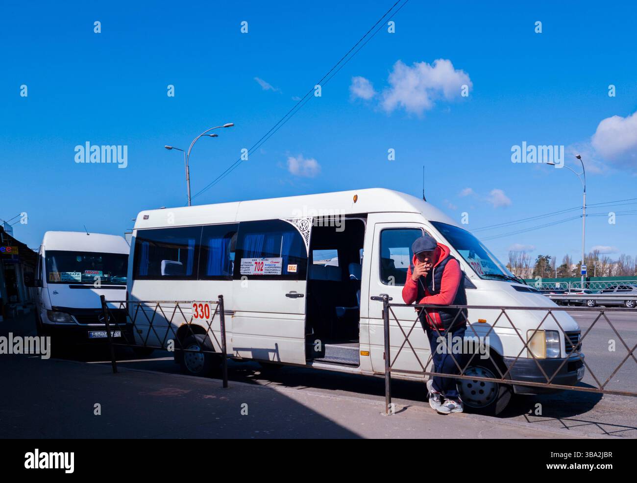 Kyiv, Ukraine - 1st May, 2025: Bus driver smoking a cigarette while ...