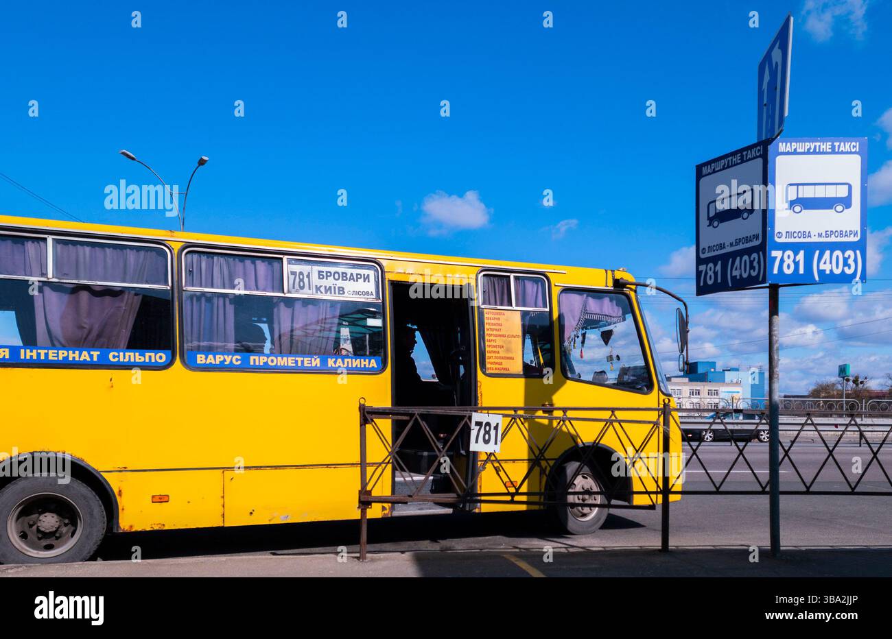 Kyiv, Ukraine - 1st May, 2025: Old yellow bus waiting at the bus stop ...