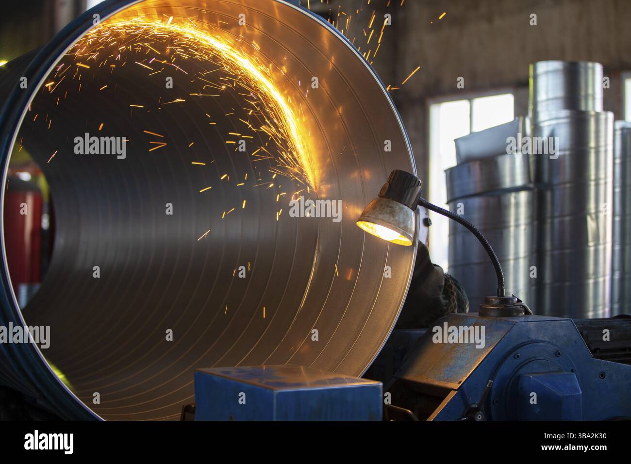Production of ventilation metal pipes. Metal welding. Metal industry ...