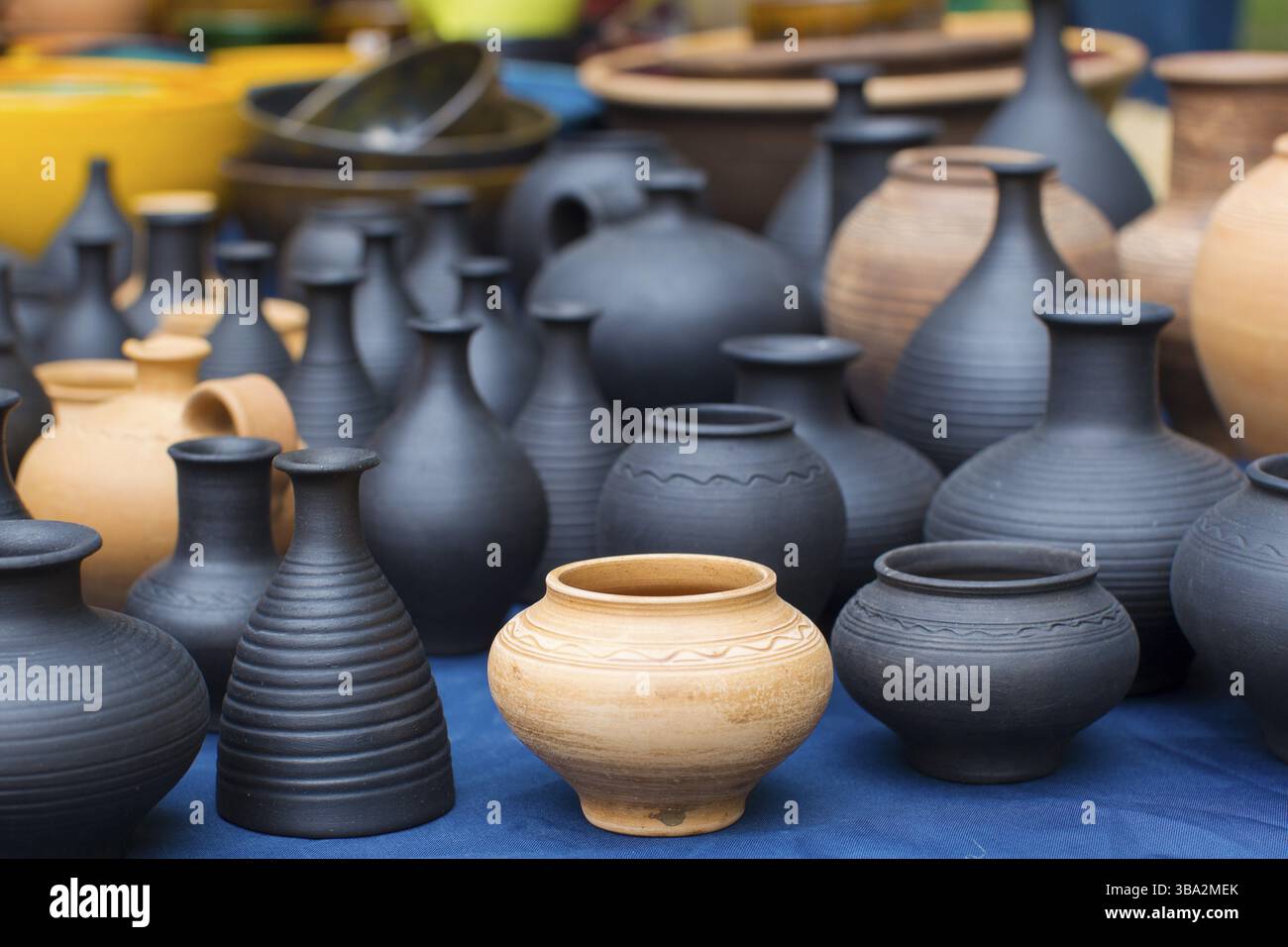 Clay vessels of different colors. Ceramics Stock Photo - Alamy