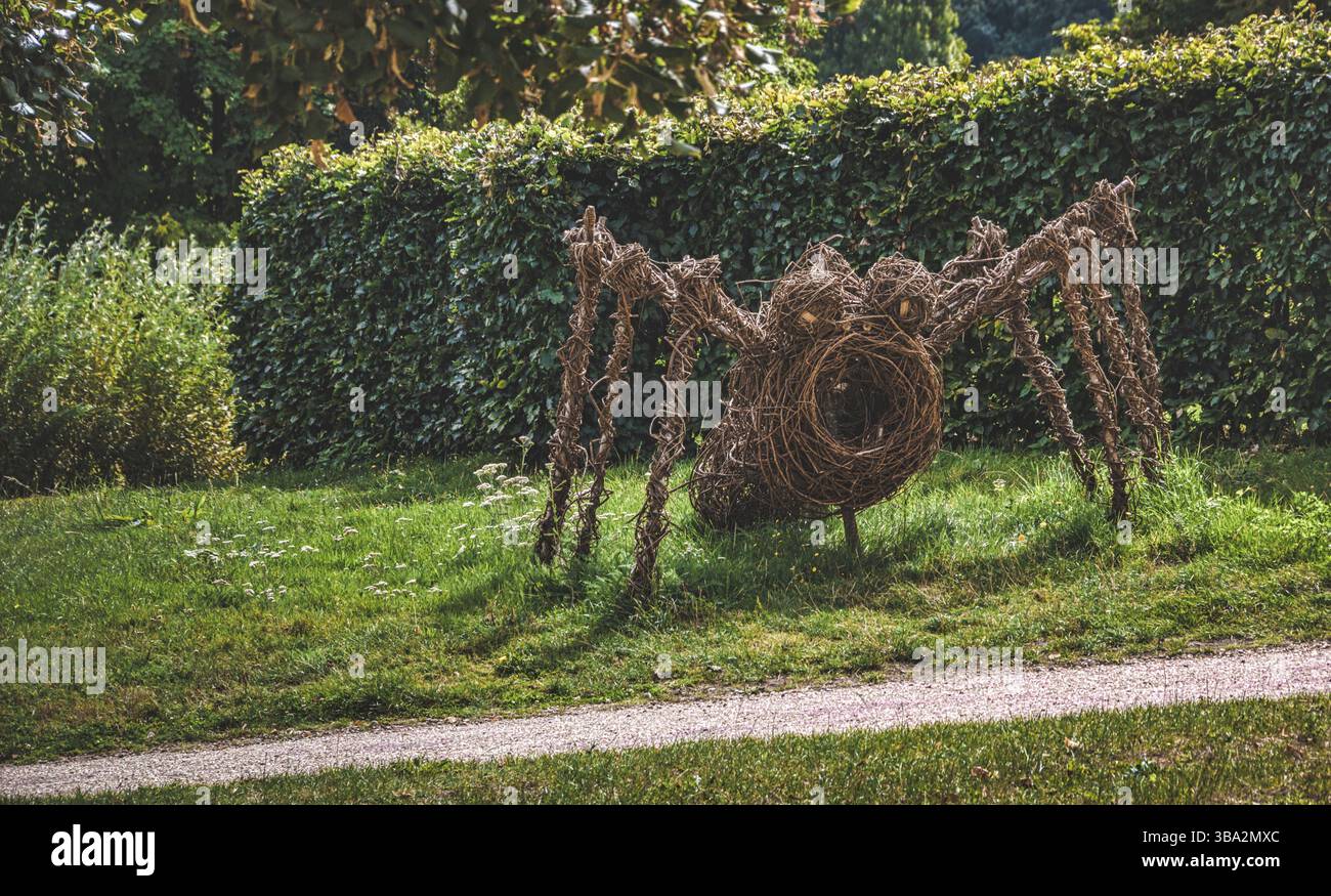 Huge spider made of wood in a french garden Stock Photo - Alamy