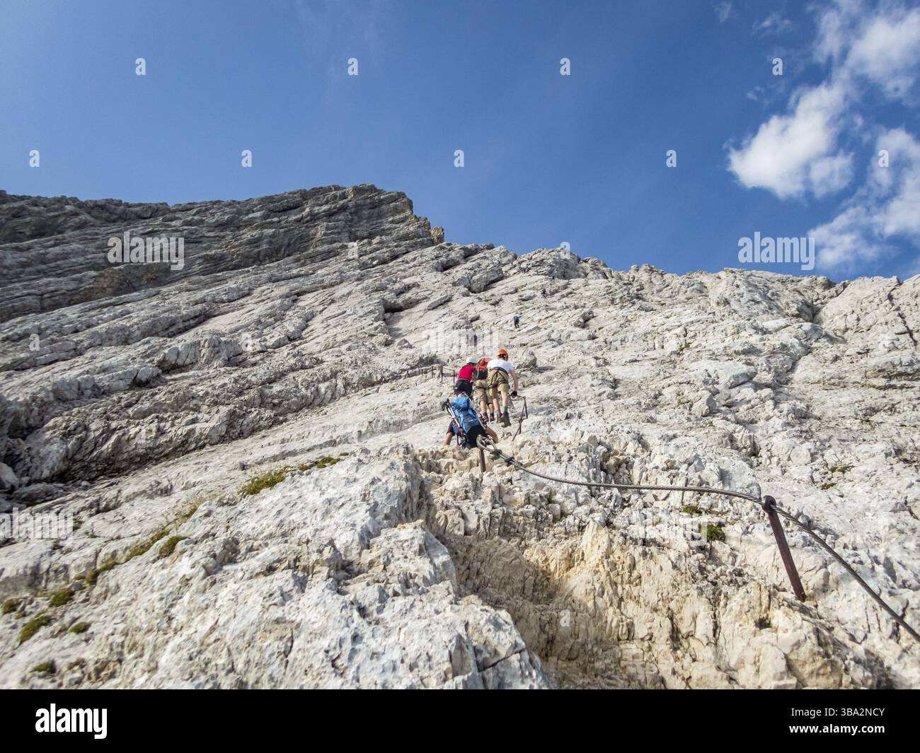 Climbing on the Alpspitze via ferrata in the Wetterstein Mountains near ...