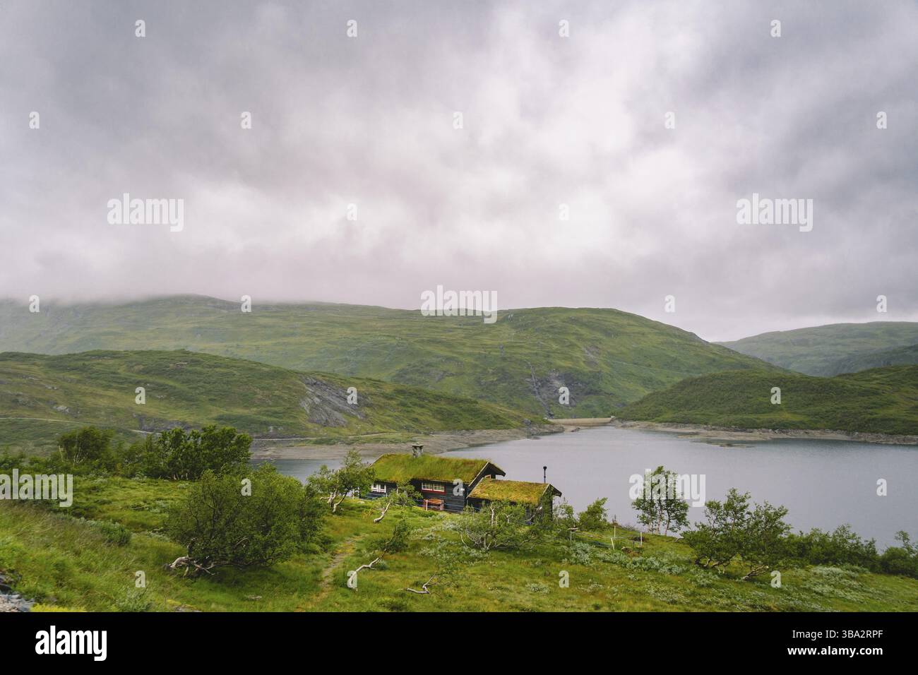 Norwegian wooden summer house (Hytte) overlooking scenic lake, Norway ...