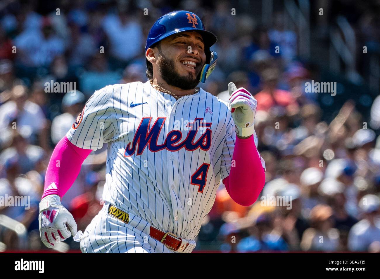 New York Mets' Francisco Alvarez smiles as he singles during the eighth ...