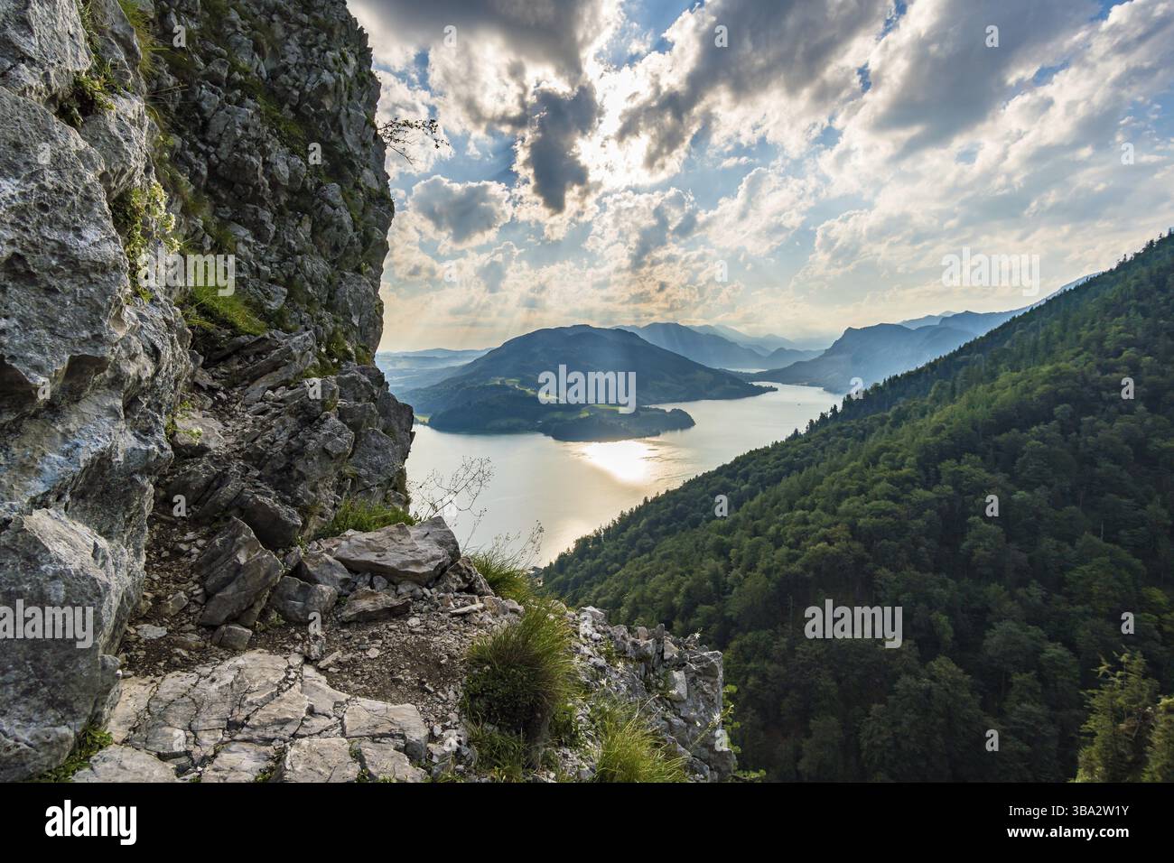 Climbing on the Drachenwand via ferrata at the beautiful Mondsee Stock ...
