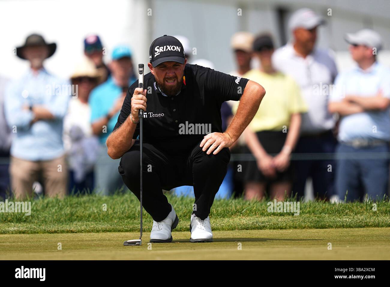 Shane Lowry, of Ireland, prepares to putt on the sixth hole during the ...
