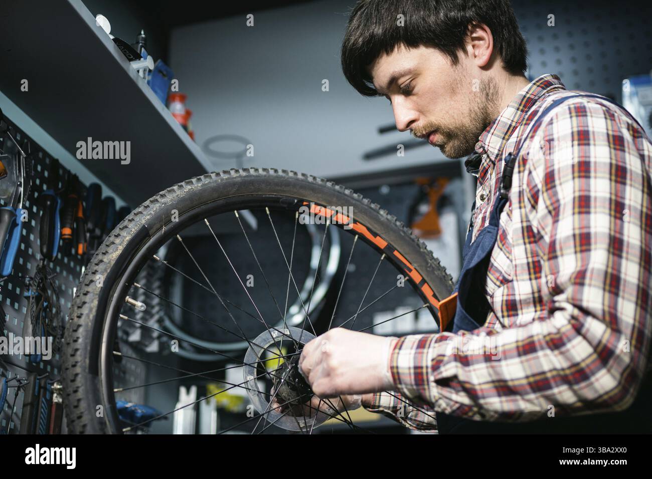 Man making bike in workshop hi-res stock photography and images - Alamy