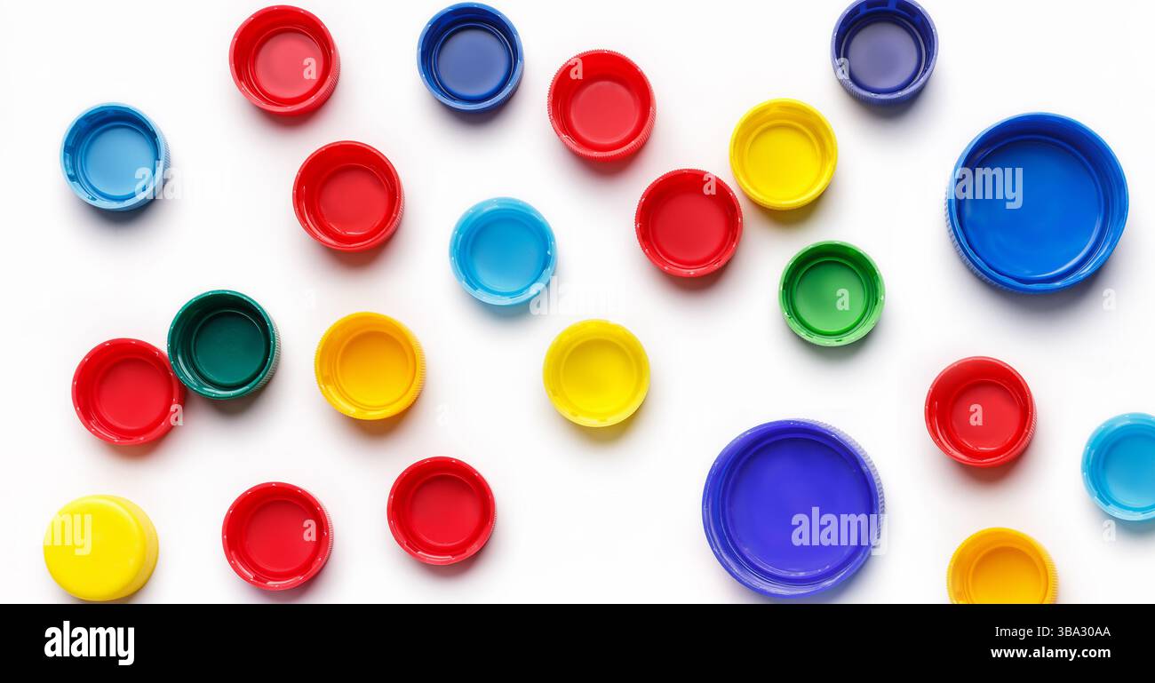 Colored plastic bottle's covers on white Stock Photo - Alamy