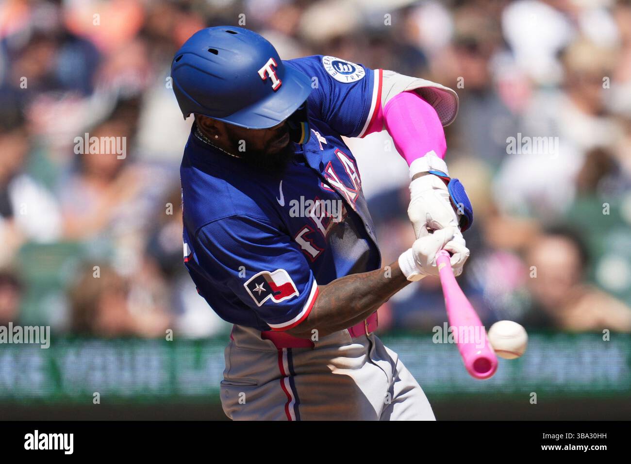 Texas Rangers' Adolis García hits a pitch that Detroit Tigers third ...