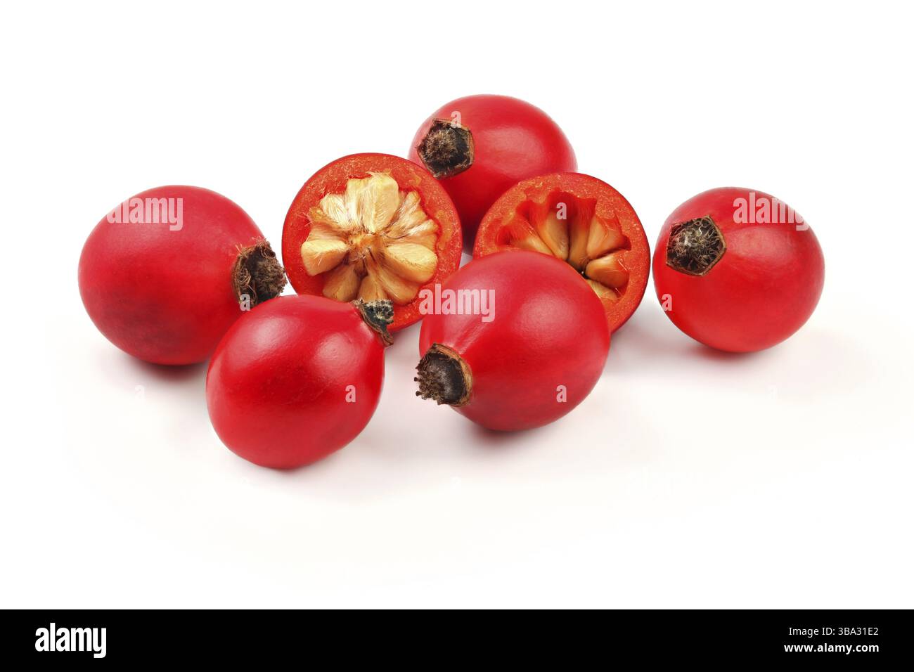 Rosehips (Rosa Canina fruits), one cut in half, isolated on white ...