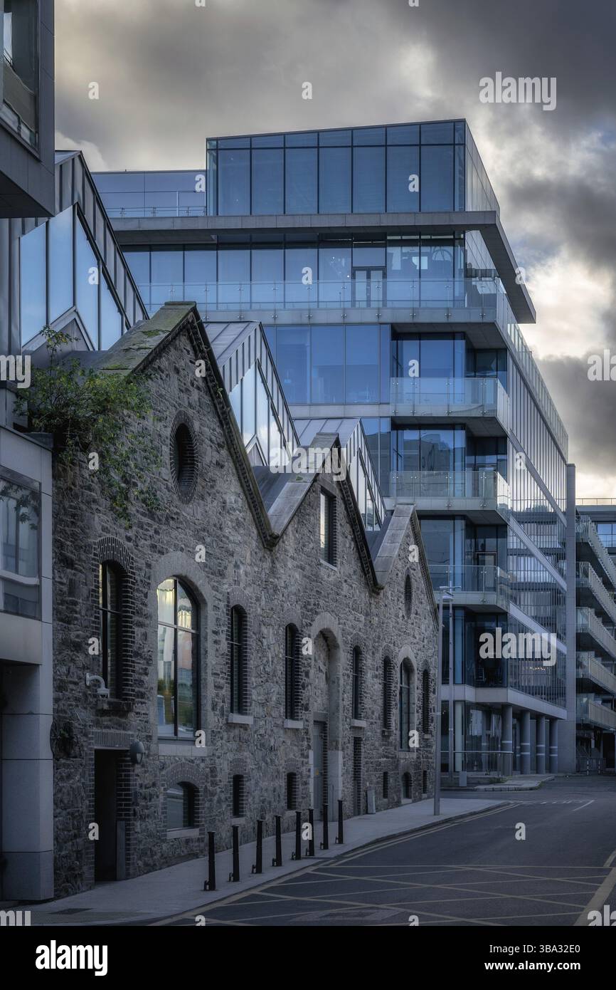 Old building converted to modern one with preserved retro facade. Mix ...