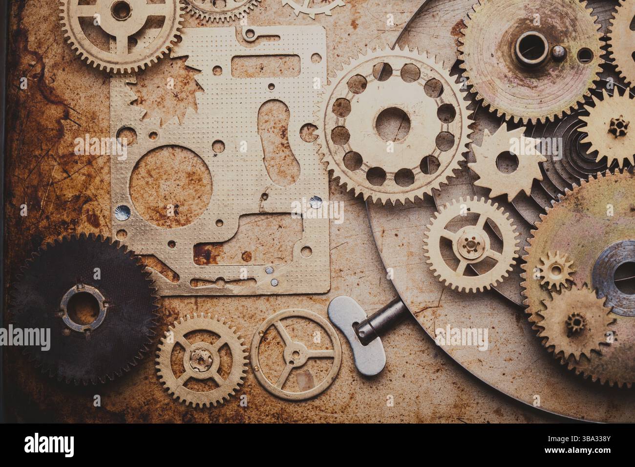 Steampunk background from mechanical clocks details over old metal ...