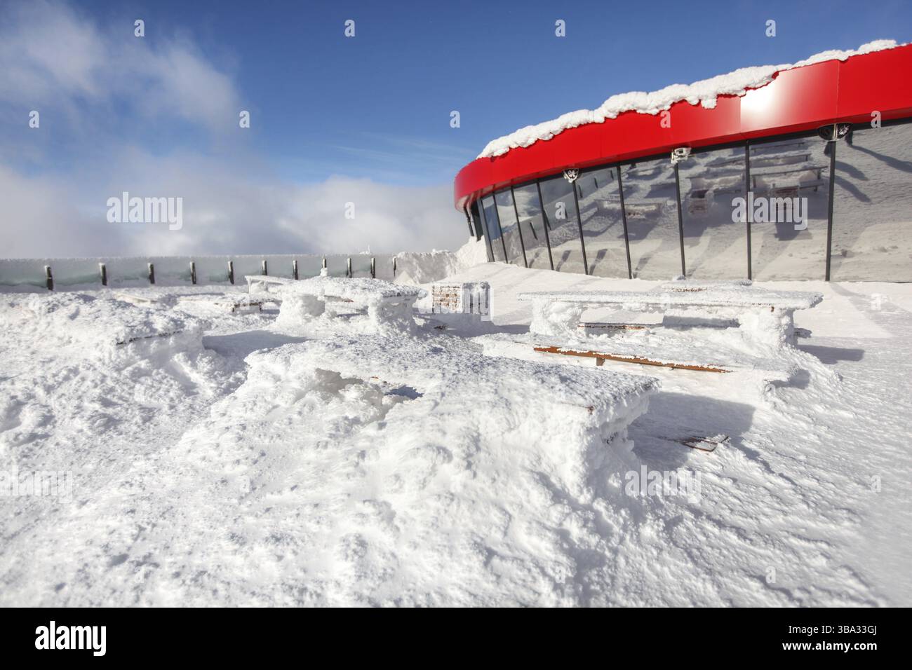 Restaurant open terrace during winter. Heavy snowing caused wooden ...