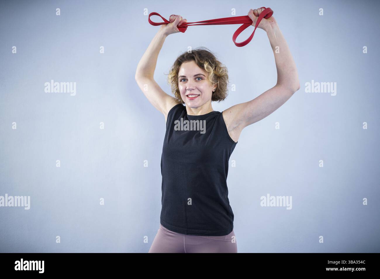 Young woman performs resistance hi-res stock photography and images - Alamy