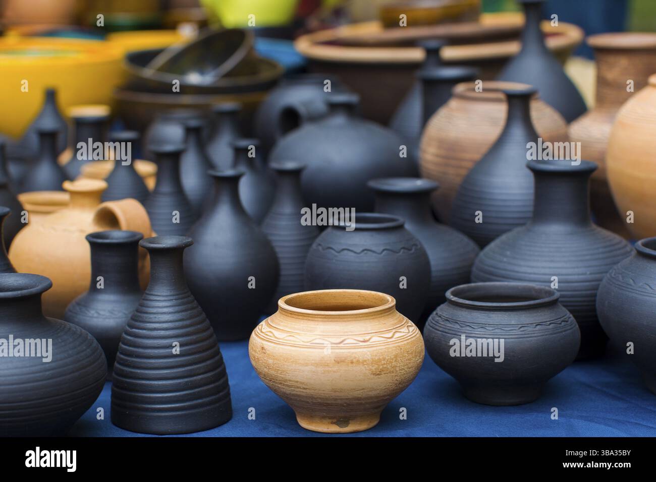 Clay vessels of different colors. Ceramics Stock Photo - Alamy