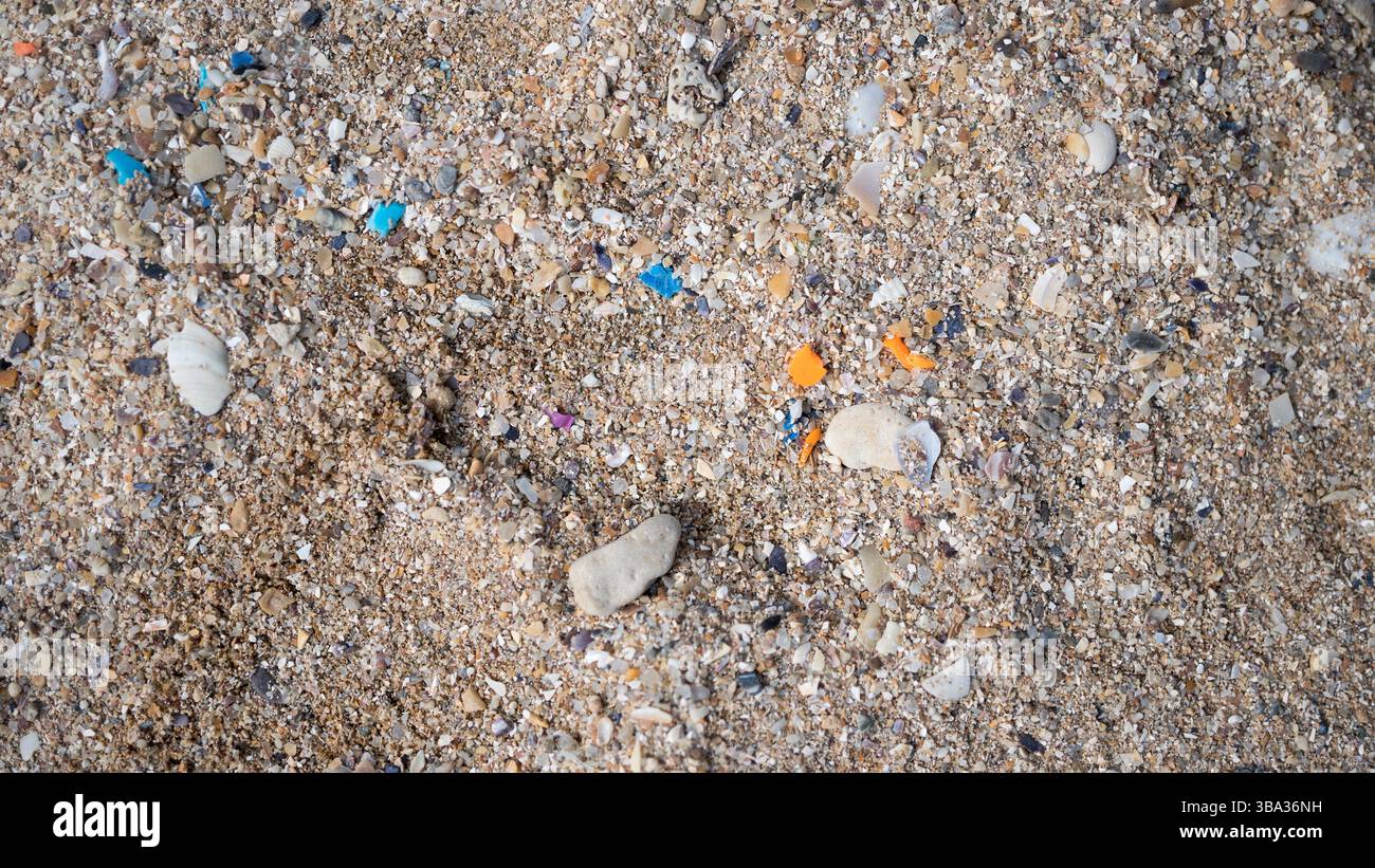 Macro plastic waste contamination in the sand on the beach ...