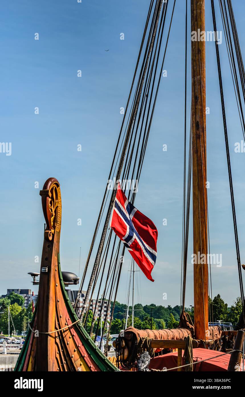 Norwegian flag on a replica viking ship showing the mast and stern ...