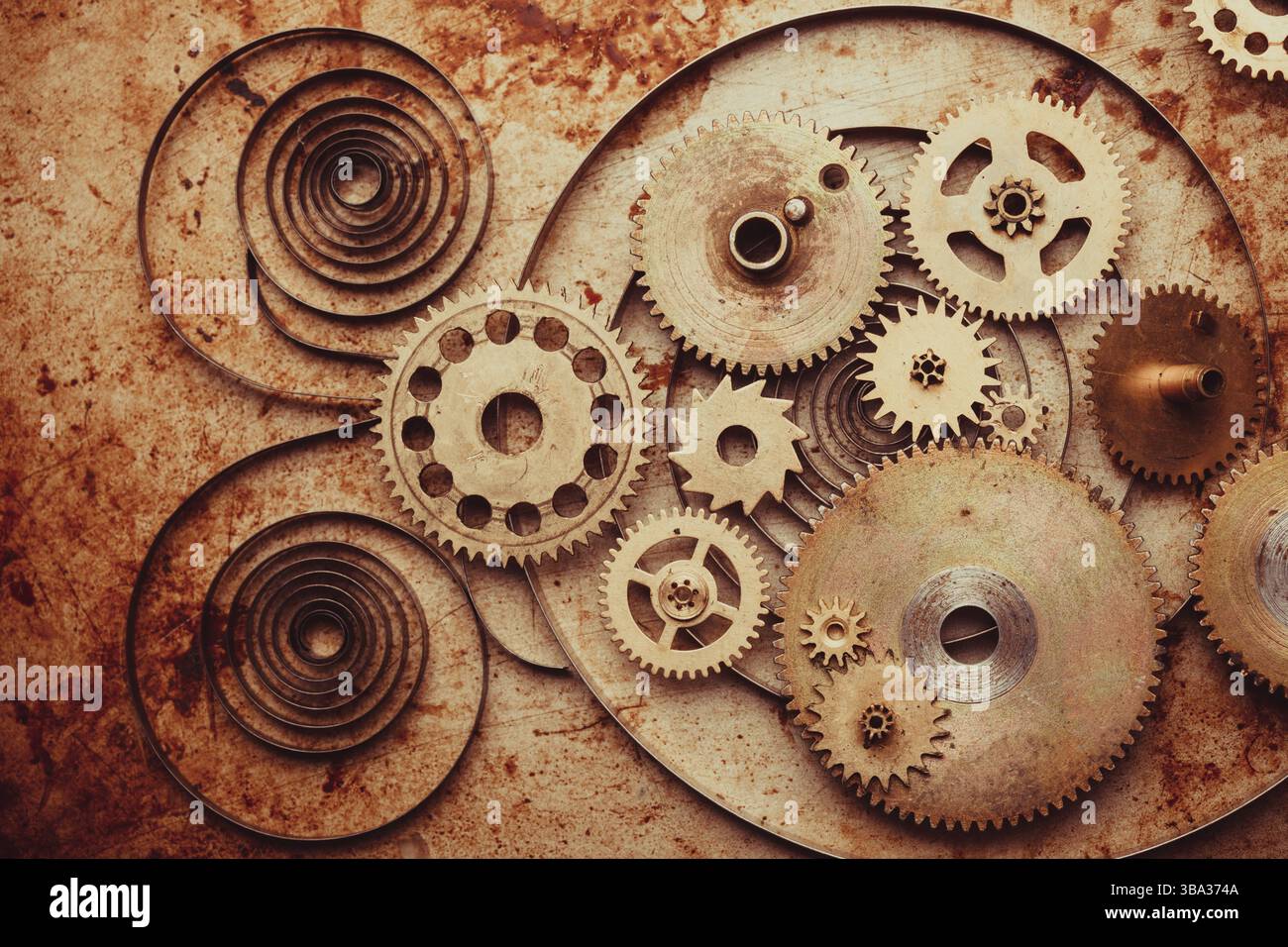 Steampunk background from mechanical clocks details over old metal ...