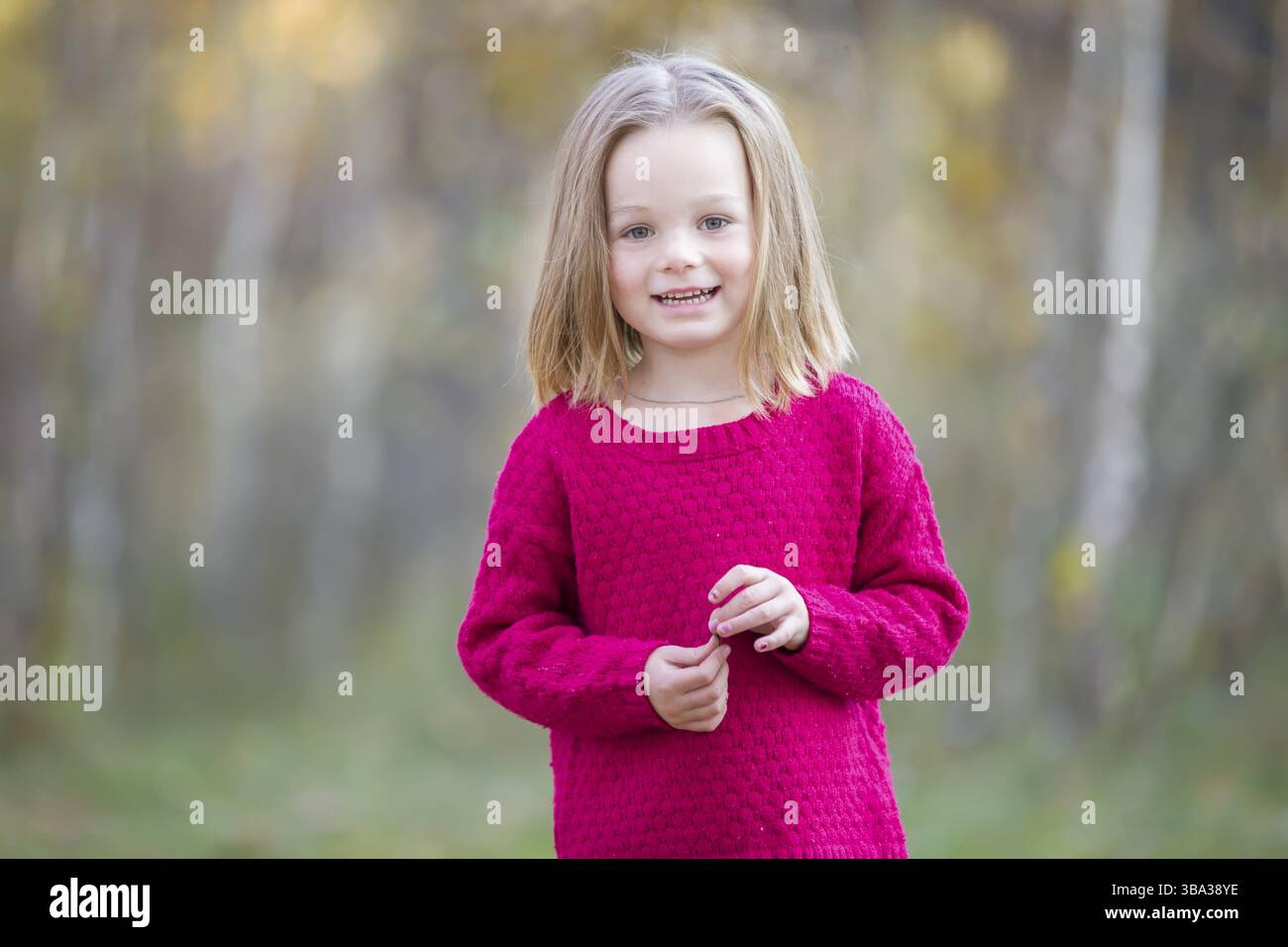Cheerful smiling child girl outdoors Stock Photo - Alamy