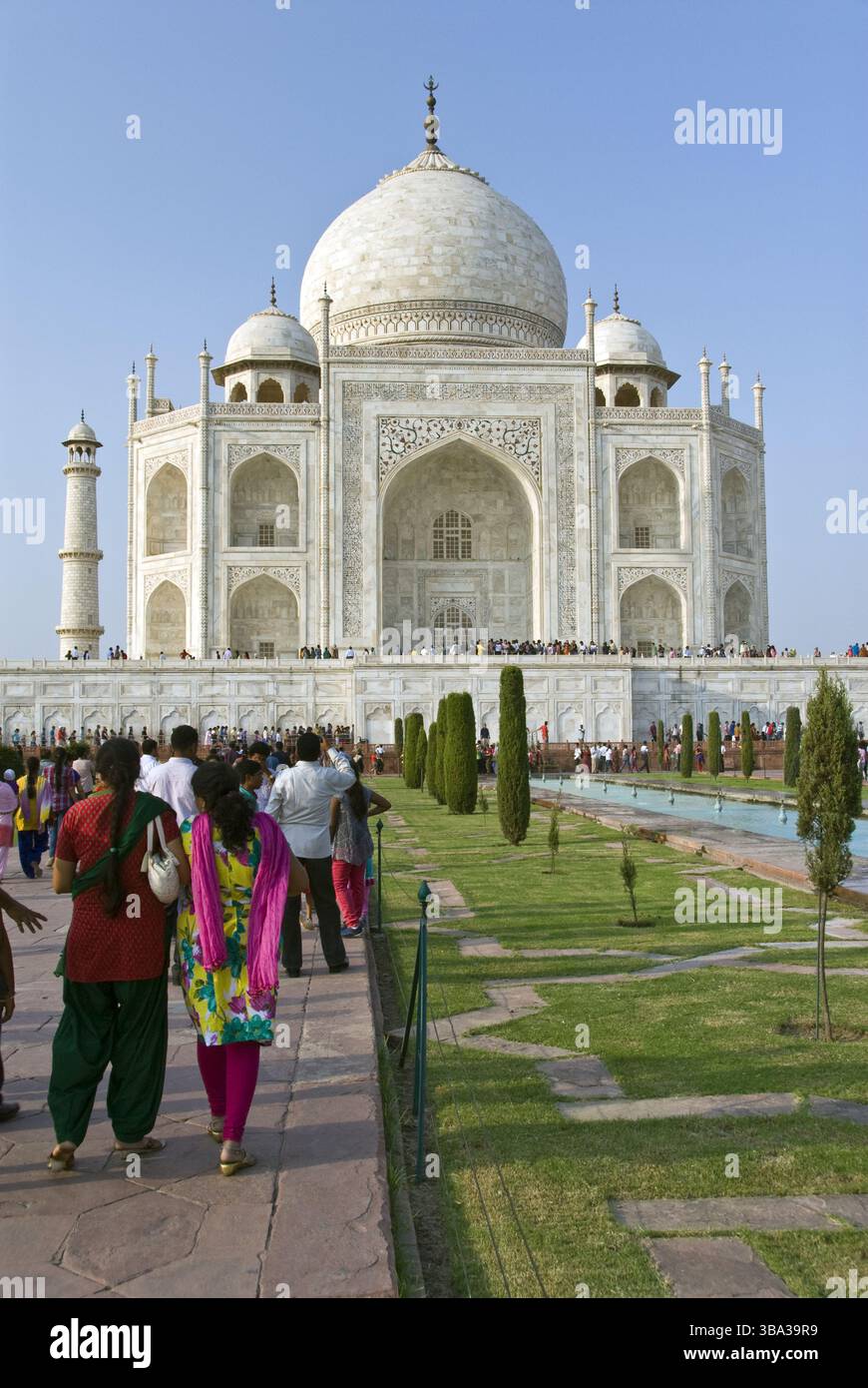 Visitors make photos at the Taj Mahal, a white marble mausoleum in Agra ...
