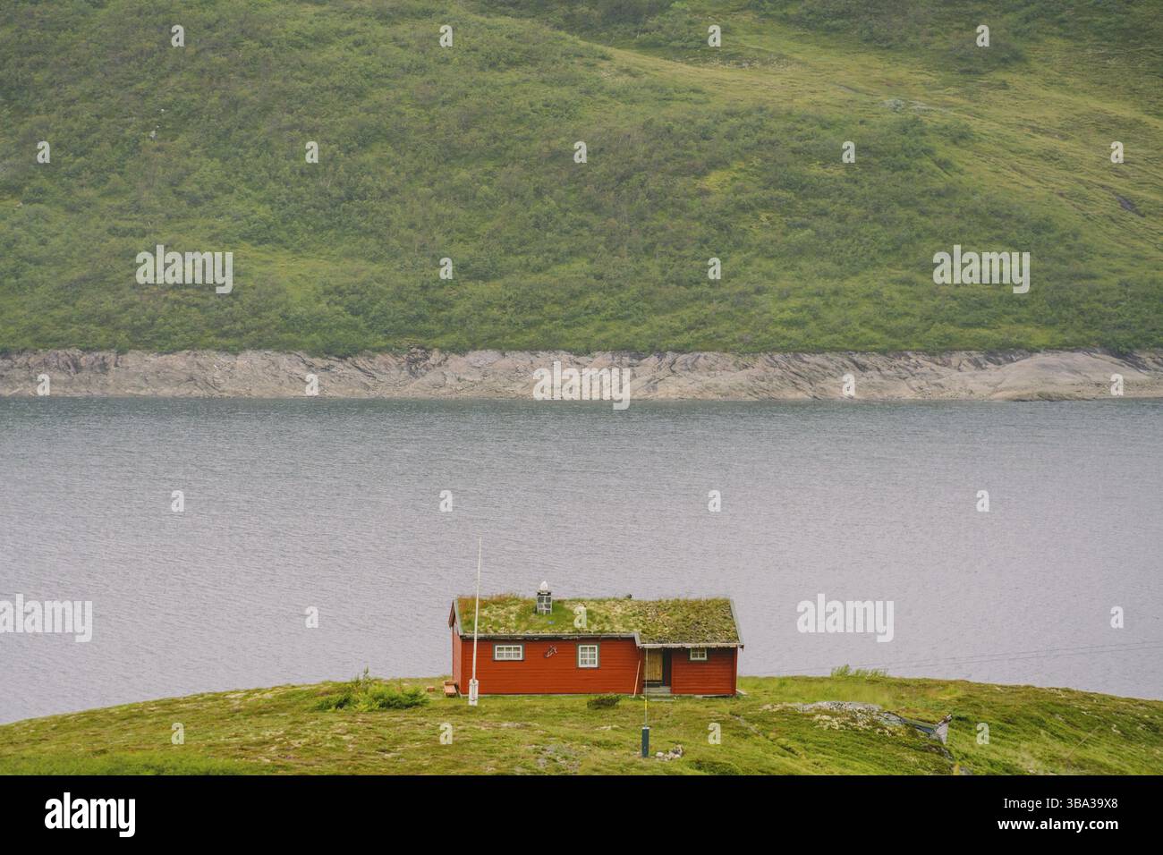 Norwegian wooden summer house (Hytte) overlooking scenic lake, Norway ...