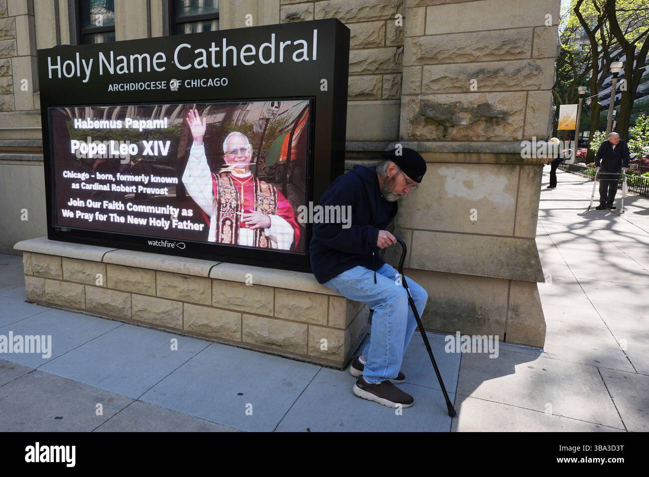 Pat Kelley sits on a ledge outside after a morning mass at Holy Name ...