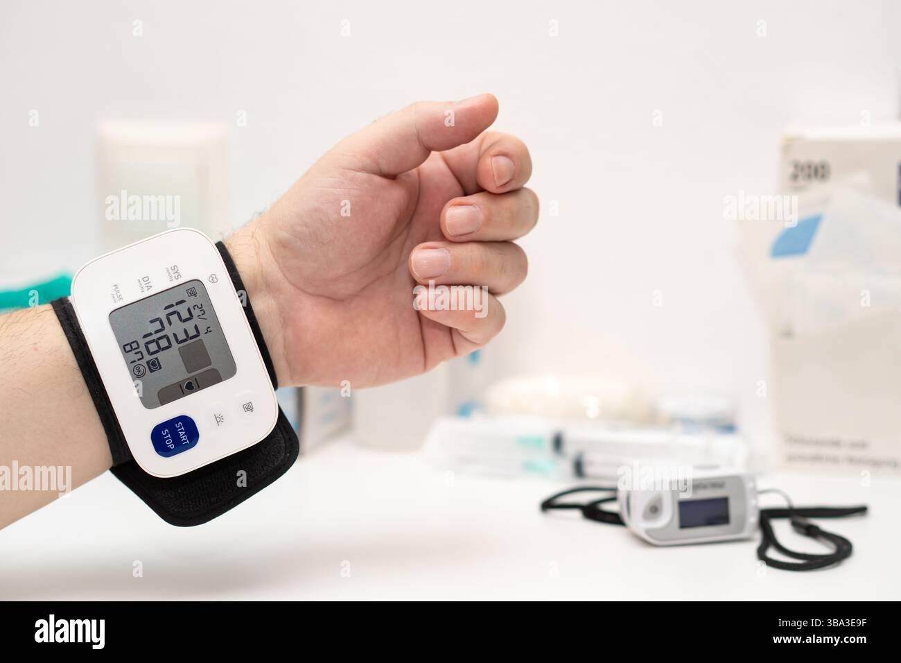 Measuring blood pressure with a wrist blood pressure monitor at a ...