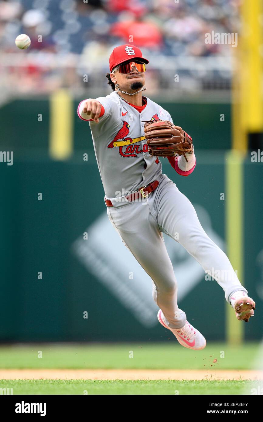 St. Louis Cardinals shortstop Masyn Winn throws to first base to put ...