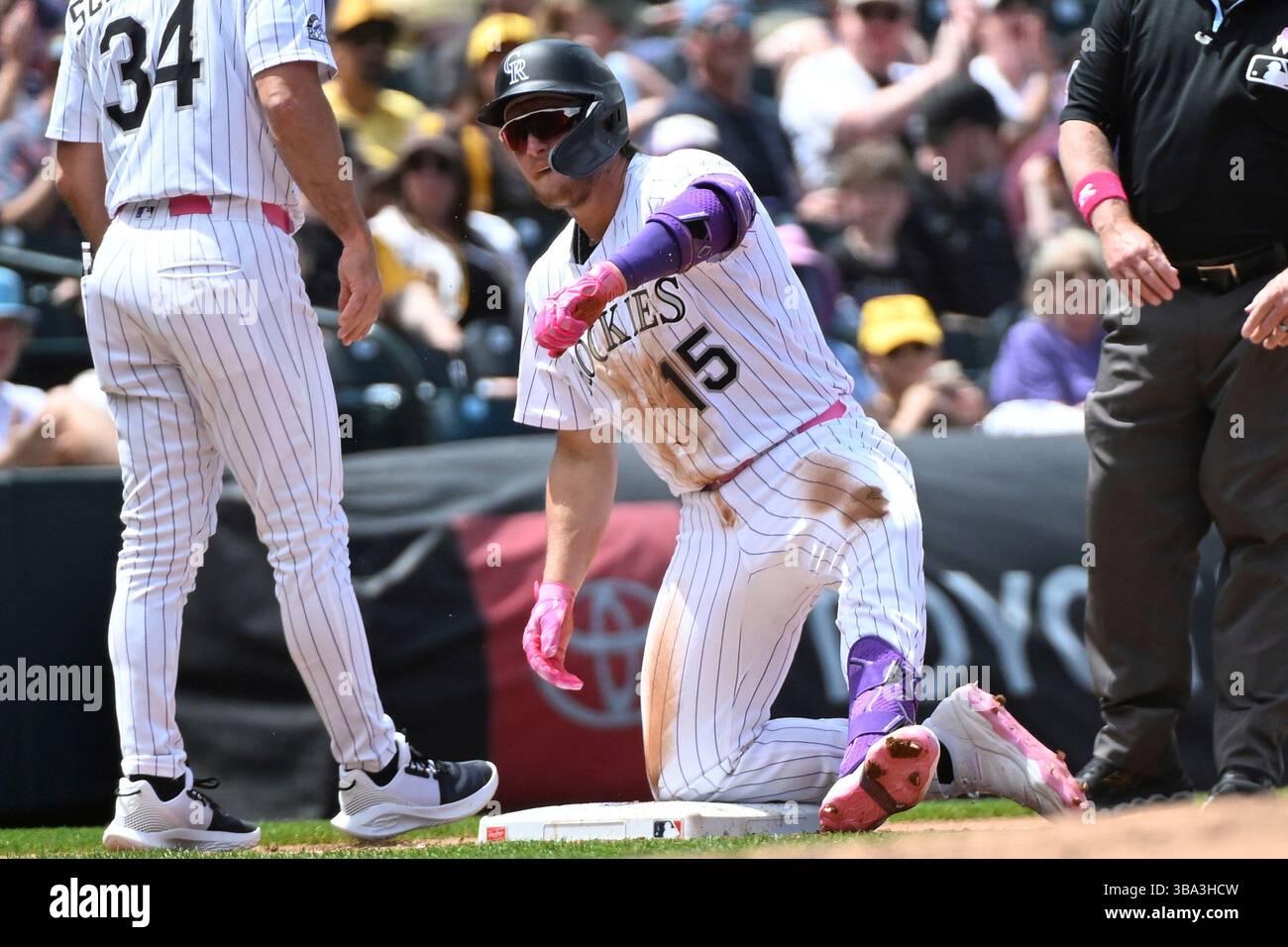 Colorado Rockies' Hunter Goodman (15) celebrates after hitting a triple ...