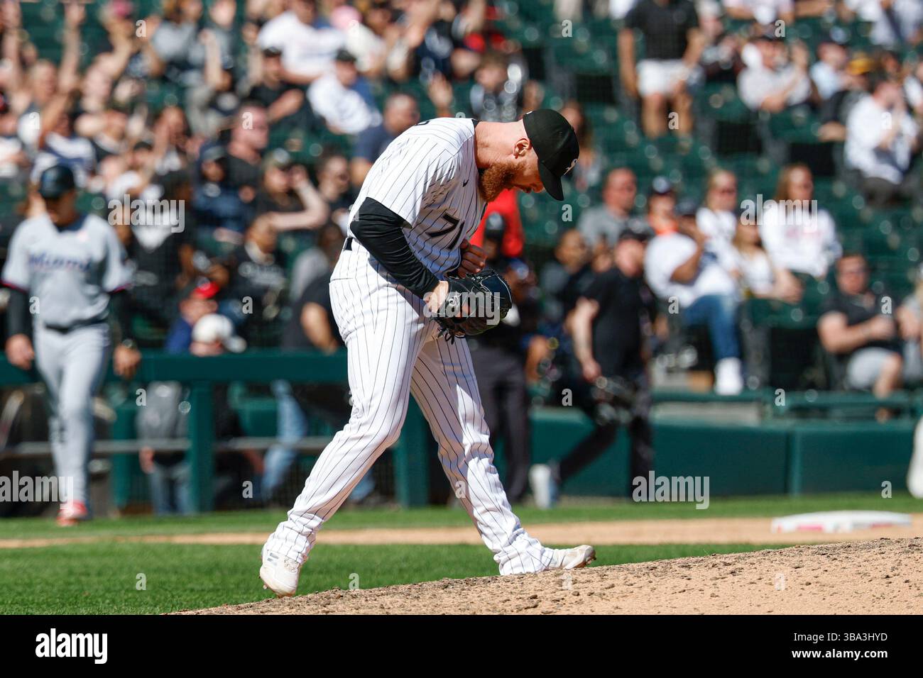Chicago White Sox relief pitcher Cam Booser celebrates after his team's ...