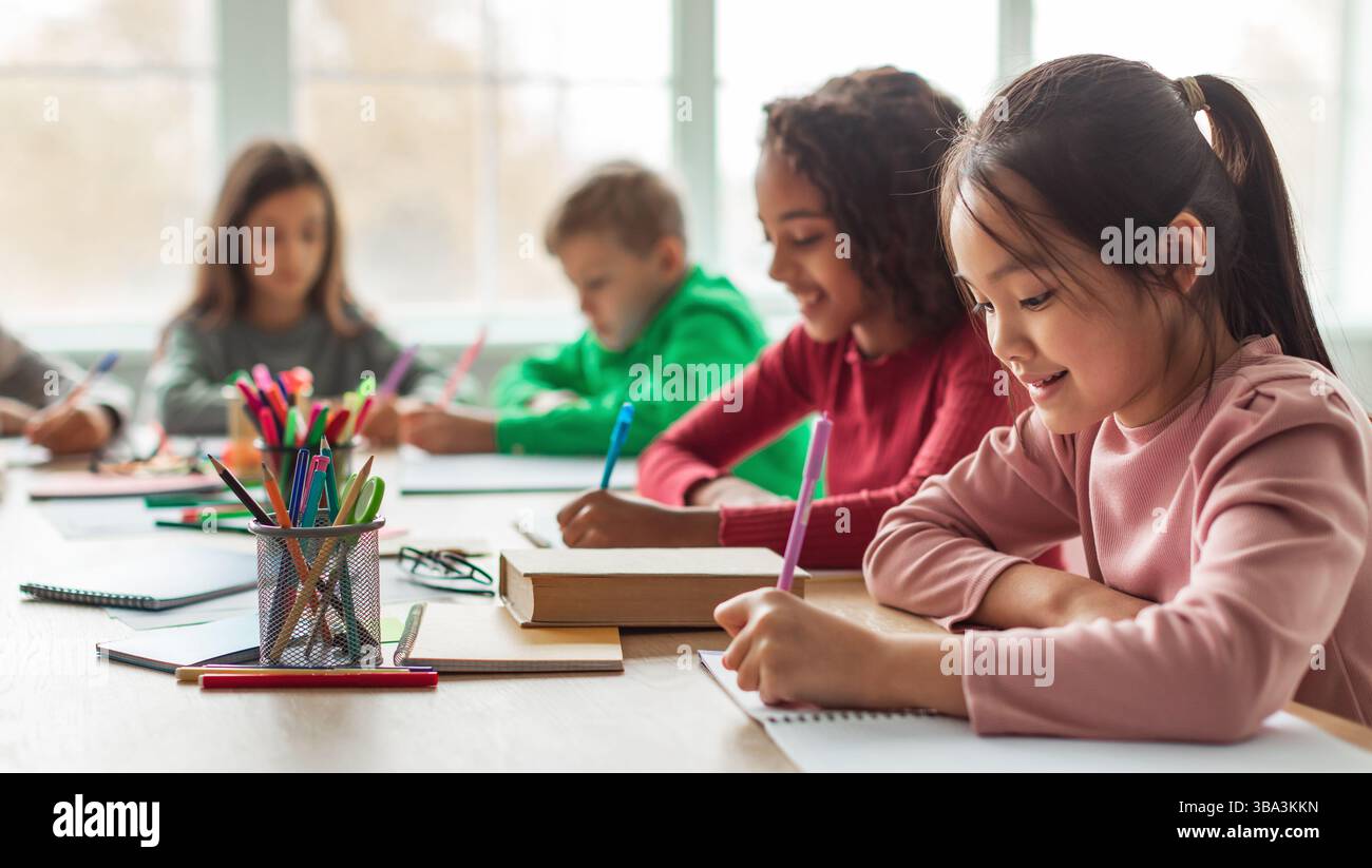 Japanese Schoolgirl Taking Notes Writing Essay Learning In Classroom ...